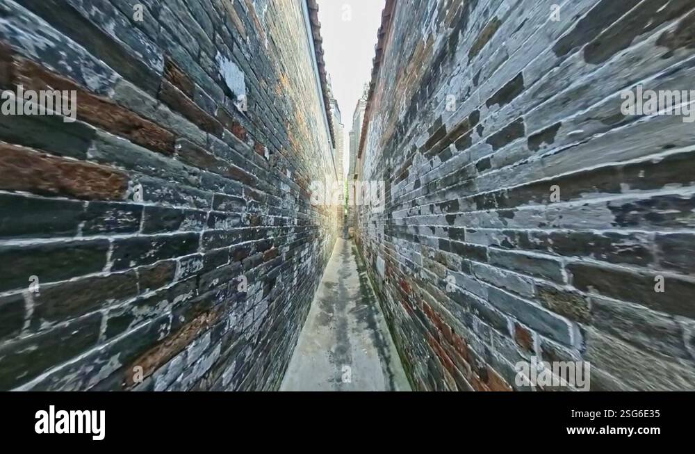 Narrow brick wall path in Yuen Long, Hong Kong Stock Video Footage - Alamy
