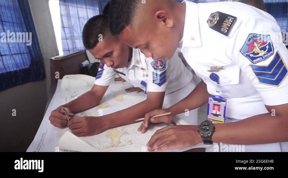 Student study RYA course with sailing map charts use Almanacs and ...