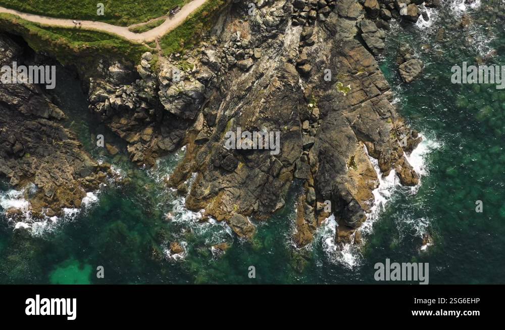 Ocean Waves Hitting Rocky Shore At St Ives In Cornwall, England ...