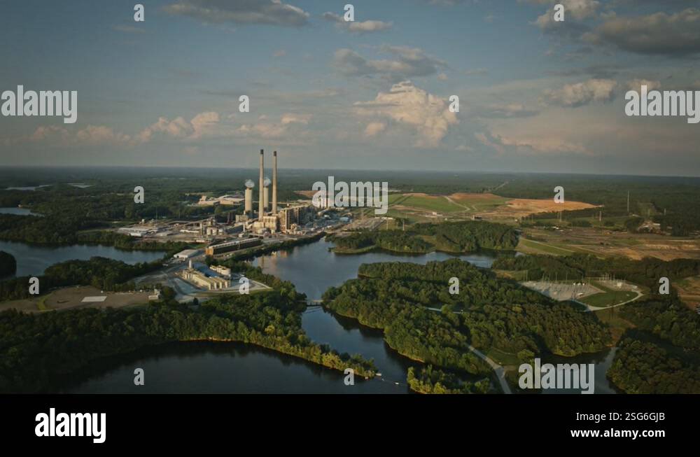 Golden sunset hour hyperlapse timelapse of power plant off of Hyco Lake ...