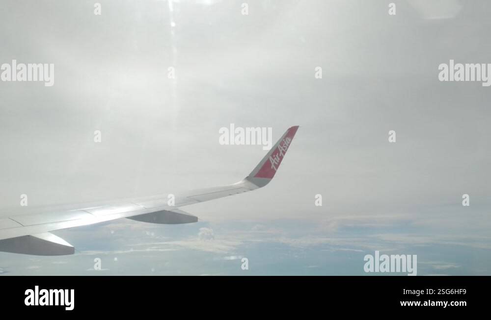 View of the airaisa airbus a320 plane wing through the airplane window ...