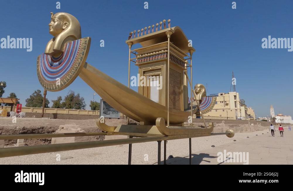 Golden chariot on sphinx avenue, Luxor, Egypt. Ancient Egyptian litter ...