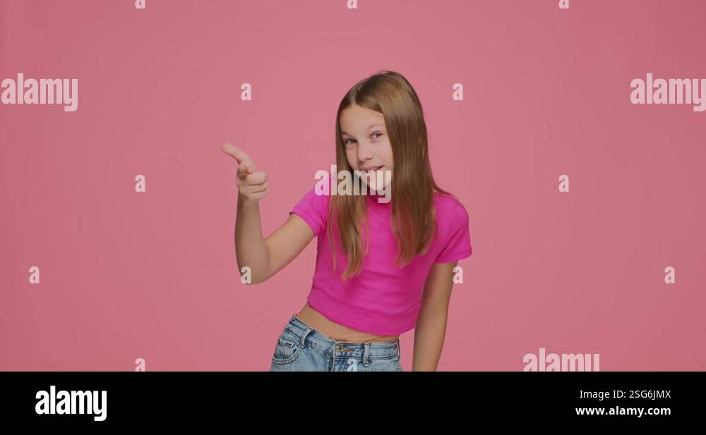Hey you, choice gesture. Funny child girl pointing to camera by fingers ...