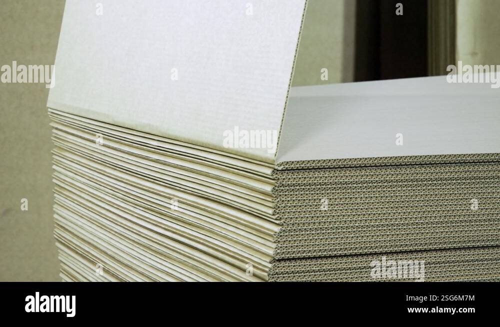 Paper corrugated box factory. Closeup image of sheets of cardboard. 4K ...