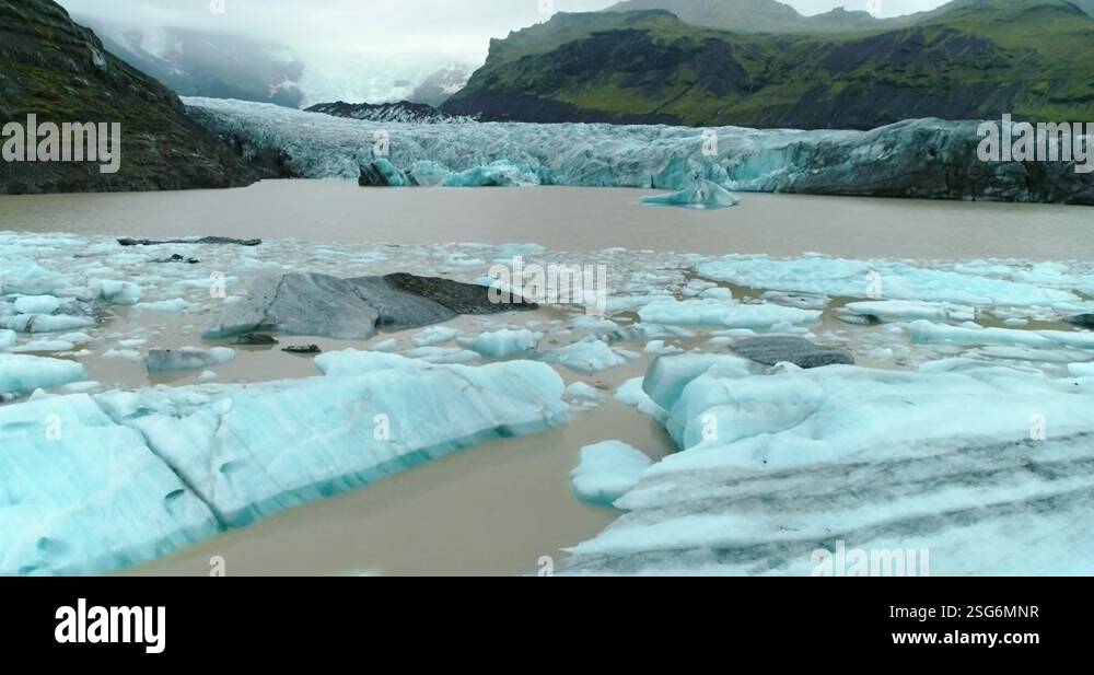 Beautiful cold scenery in Iceland, glacier sheets floating over sea ...