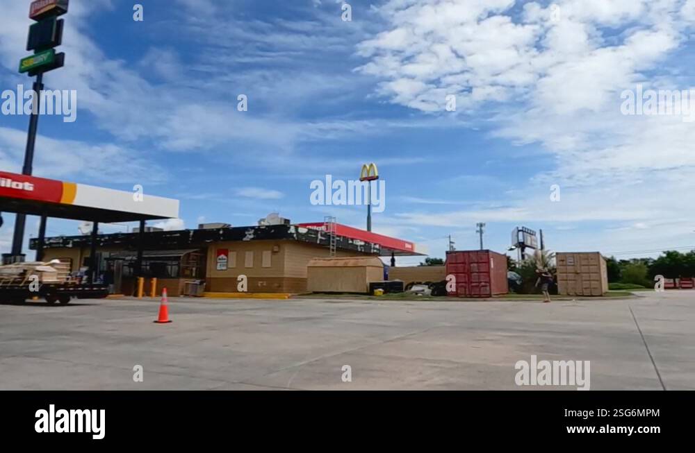 Pan semi trucks parked at diesel pumps Pilot gas station slow motion ...