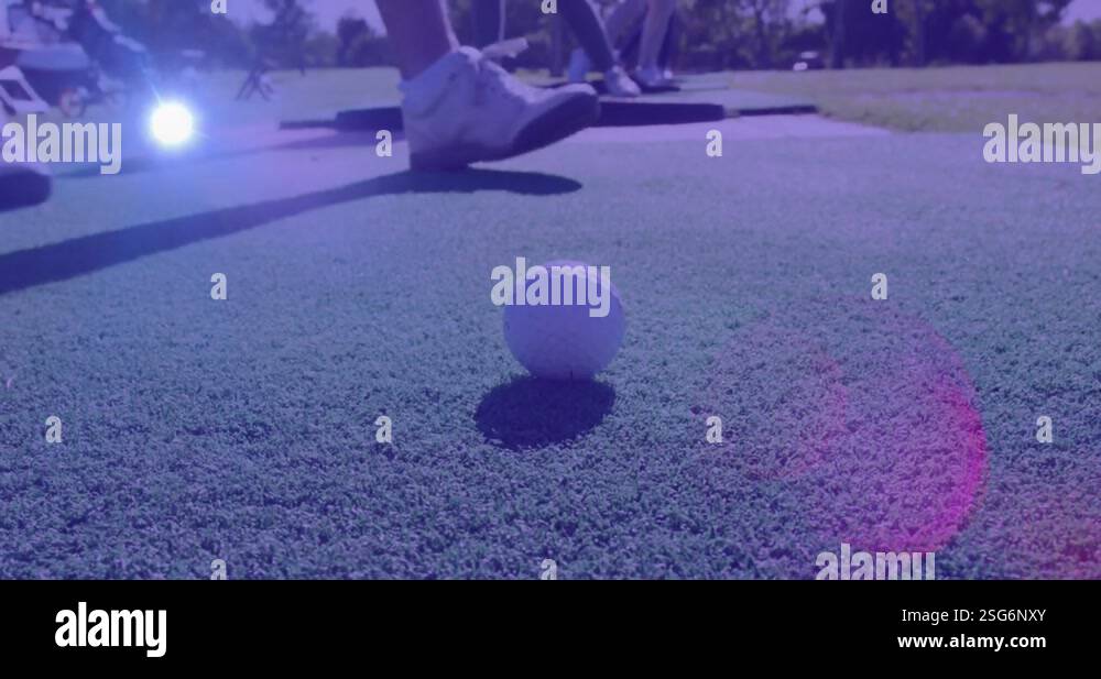 Animation of light trails over caucasian man playing golf on golf ...