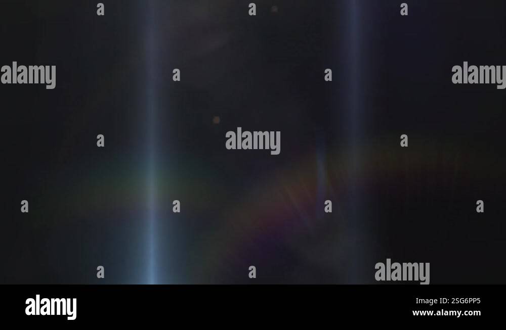 Animation of spotlight with lens flare and light beams moving over dark ...