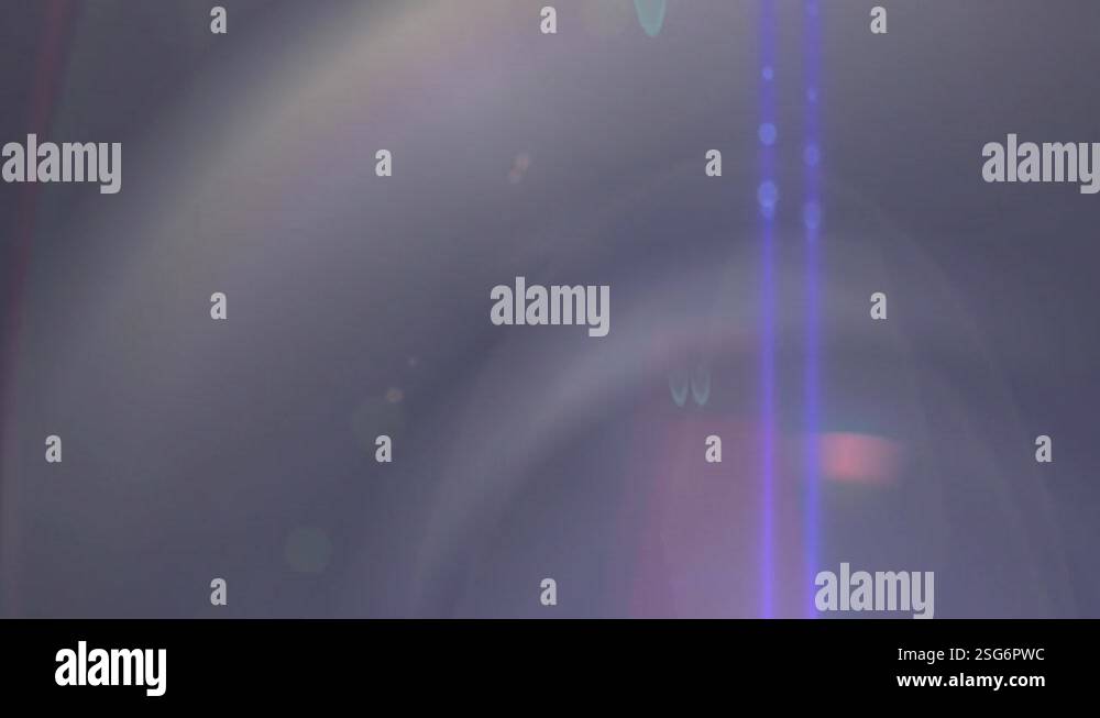 Animation of spotlight with lens flare and light beams moving over dark ...