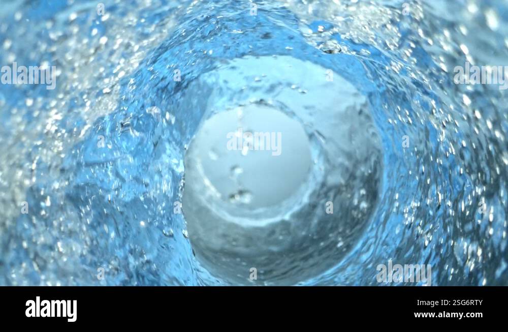 Super Slow Motion Shot of Whirling and Splashing Water in Glass Bottle ...