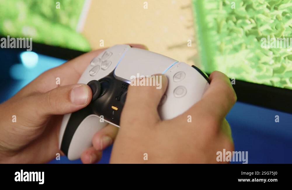 Boy Laying down his PS5 controller after gaming on his PlayStation 5 in ...