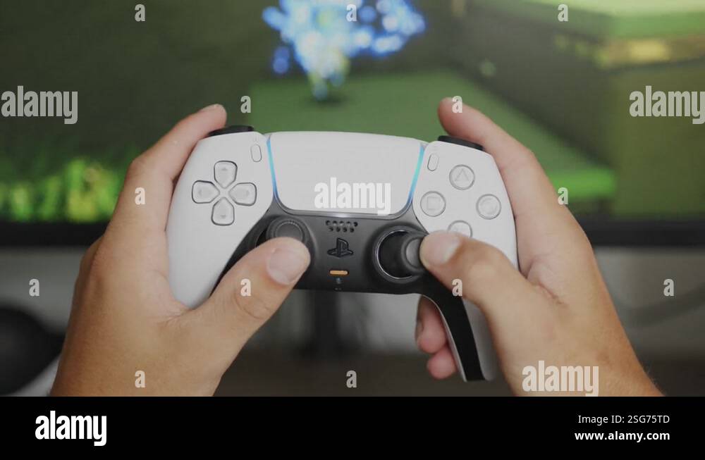 Boy gaming on a PlayStation 5 with a PS5 controller in the afternoon ...