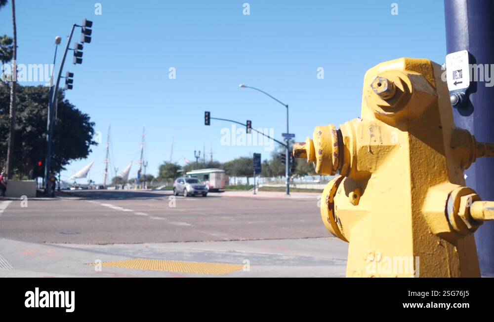 Yellow fire hydrant extinguisher on city street, California fire ...