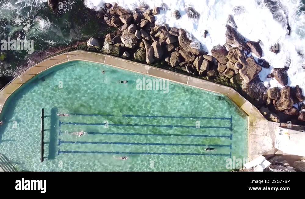 Drone aerial top view of people swimming in the famous Bronte´s ...