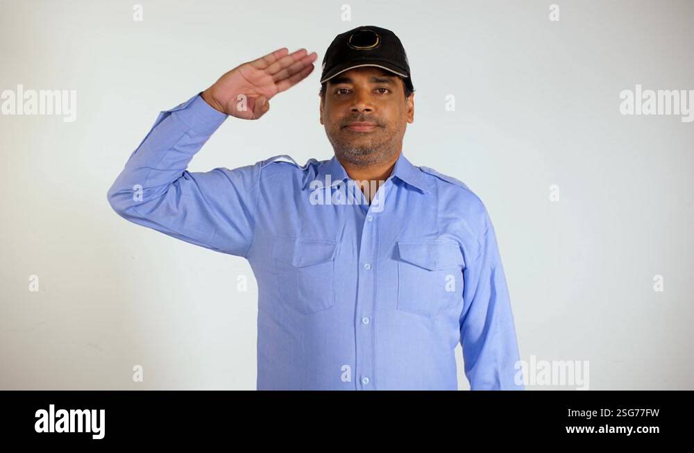 A middle-aged Indian security guard is saluting - guard on duty, poor ...