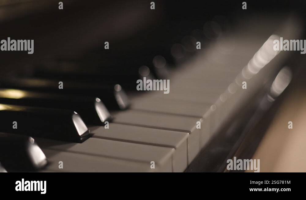 Keyboard on vertical piano seen from the left side, close up, shallow ...