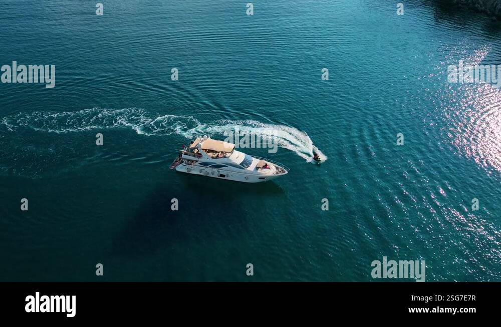Jet ski rides around the yacht aerial view 4K Stock Video Footage - Alamy