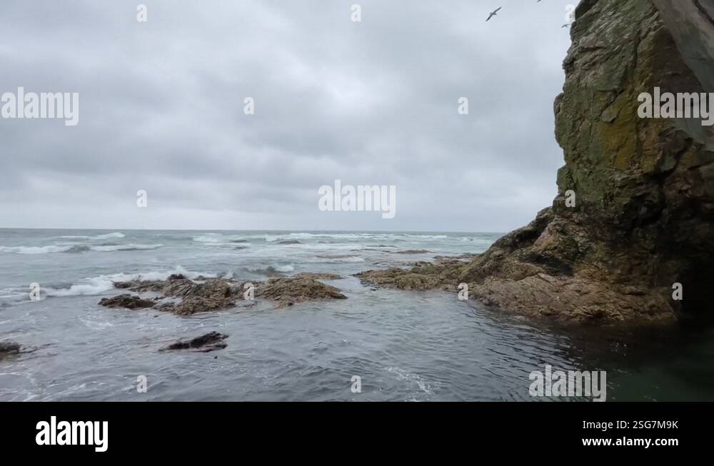 Panorama coast of Cape Velikan (Giant) with many arches and pillars ...