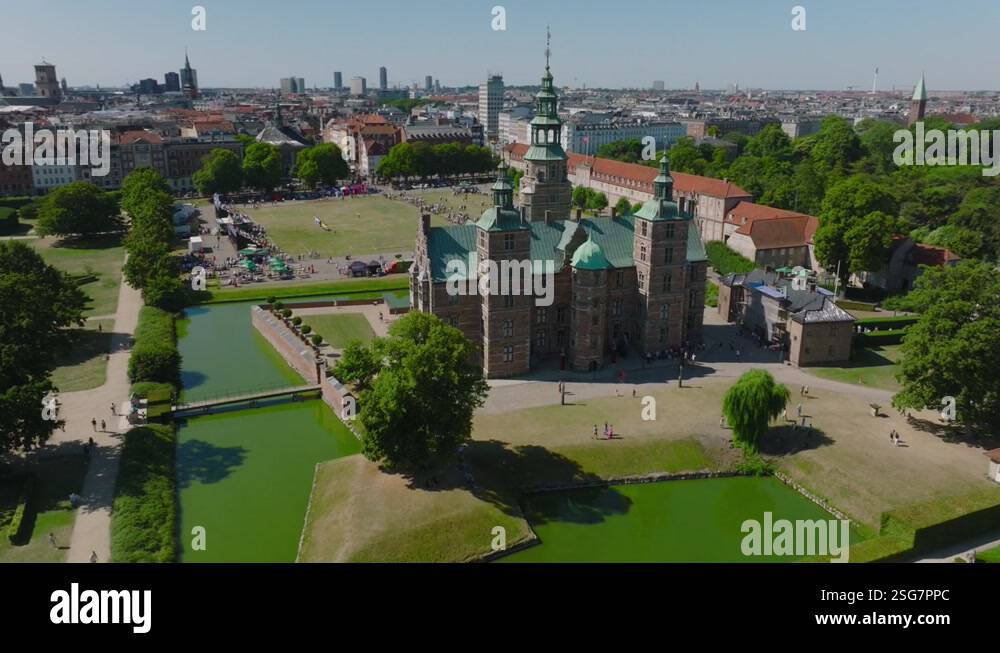Circular aerial footage of Rosenborg castle in Kongens Have park on ...