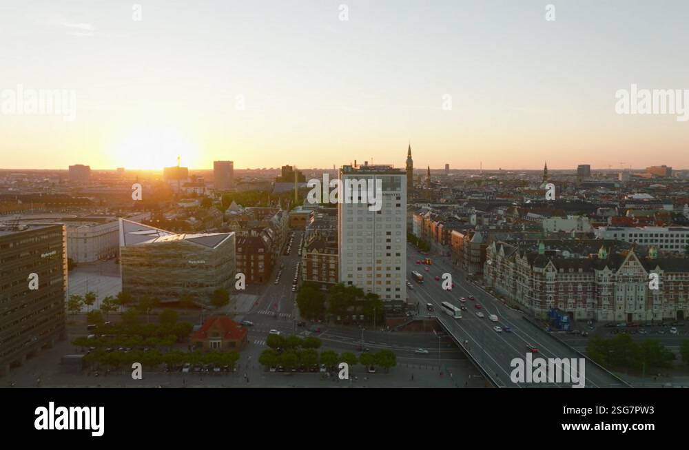 Aerial view of cityscape against sunset. Sliding reveal of modern ...