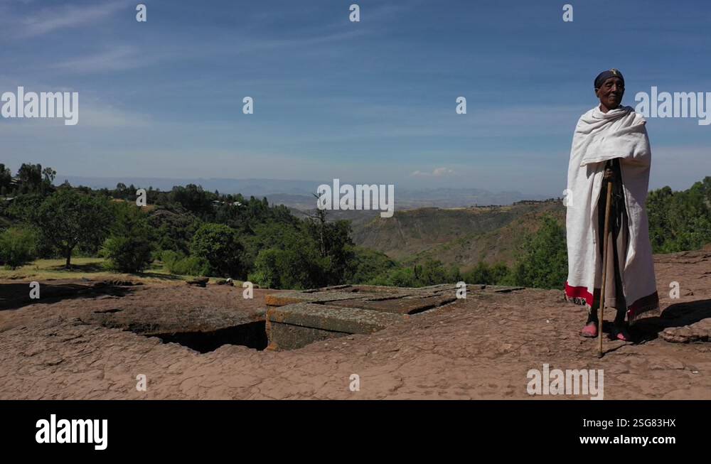 Priest in monolithic rock-cut church of bete giyorgis Lalibela ...