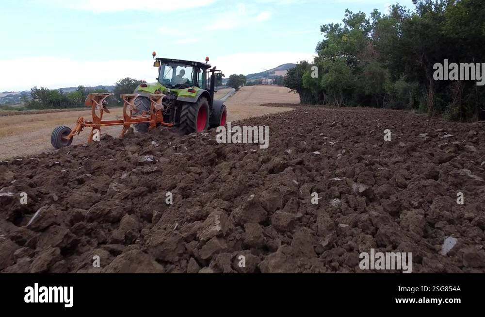 Digging up soil for seeds using motor hoes furrow plow Stock Video ...