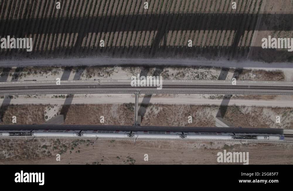 Top down shot of 2 trains crossing next to each other on a massive ...