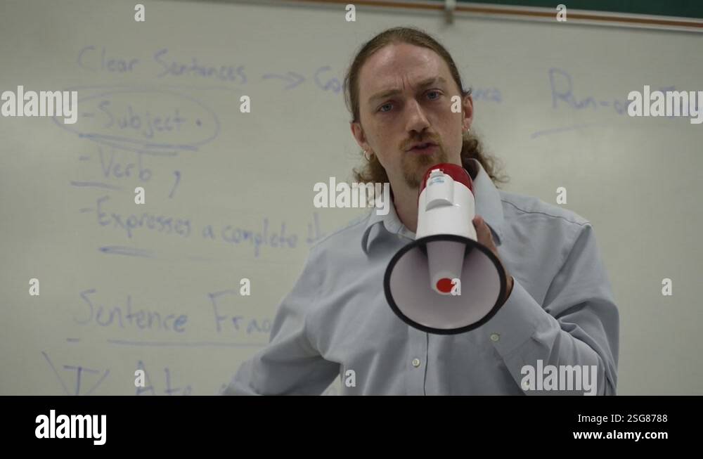 Slow motion point of view of angry teacher shouting in classroom into ...