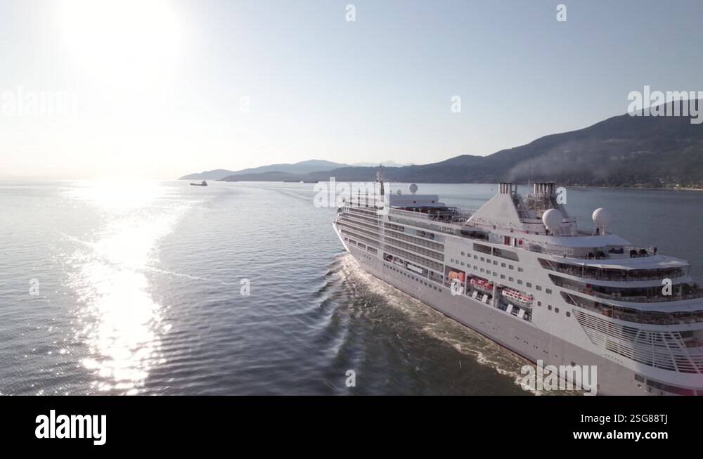 Cruise ship sailing out of Vancouver harbour at sunset, cruise line ...