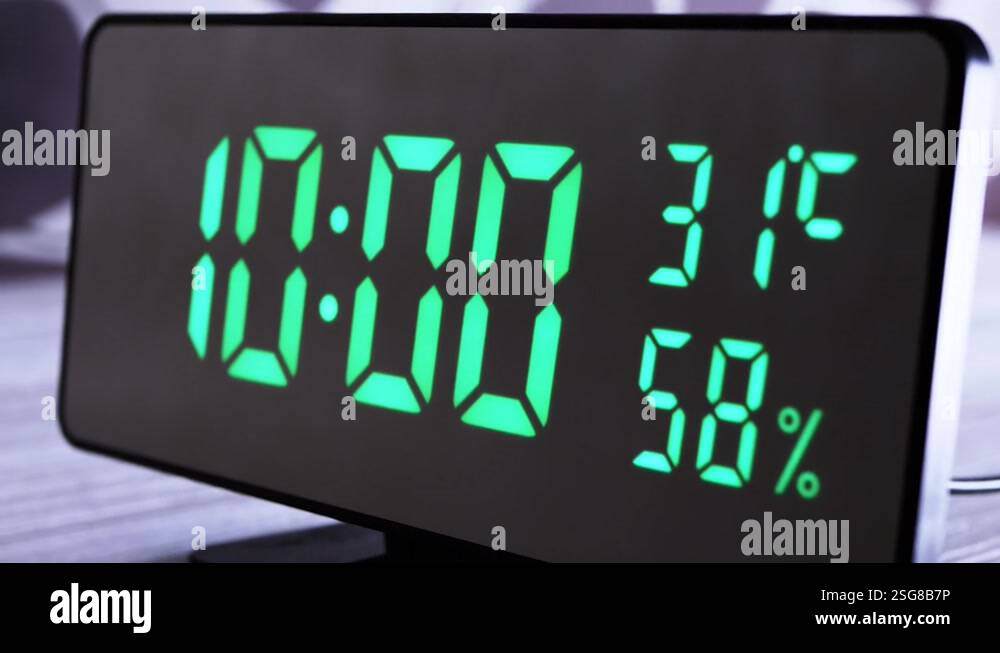 Digital Clock Showing Time on Green Display 10:00 AM, Temperature, Air ...