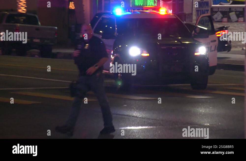 cops arrive to a crime scene Stock Video Footage - Alamy
