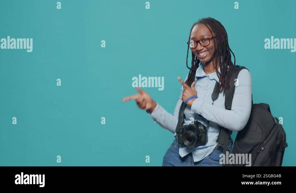 Photographer pointing at left and right side in studio Stock Video ...
