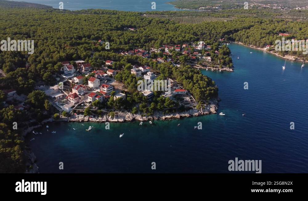 Orbit shot around luxury village with private wild beach on Brac island ...