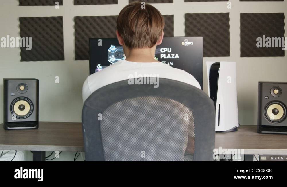 Boy walking to his gaming setup to pick up his PS5 controller and start ...