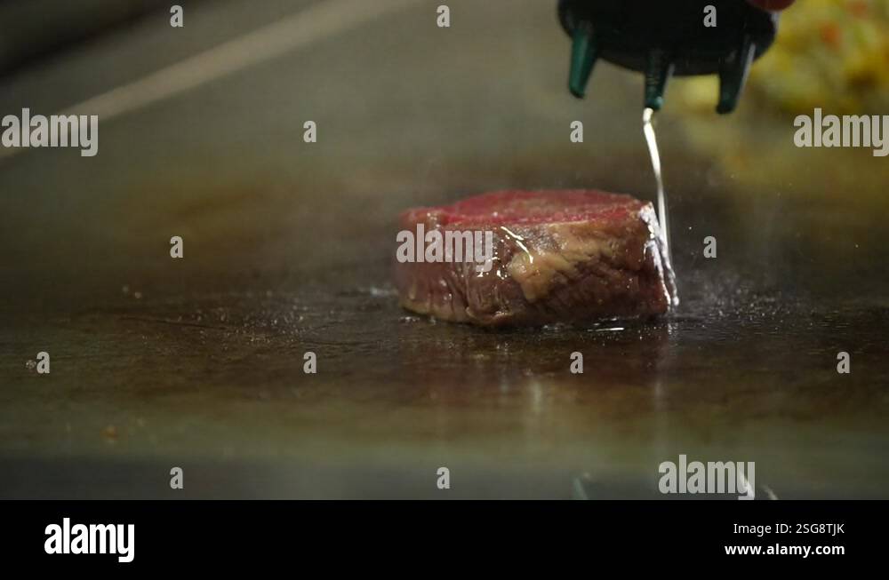 Teppanyaki Restaurants stake fry in oil oriental grill Stock Video ...