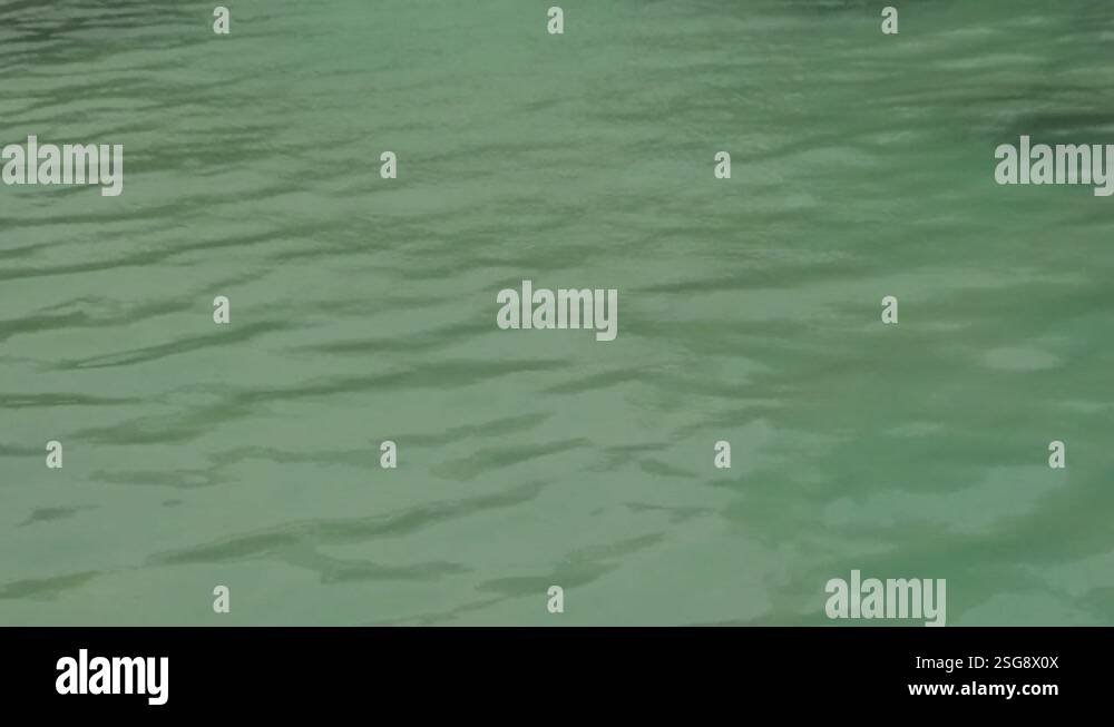 wave pool water with blue floor mat and reflection of stripes. HD video ...