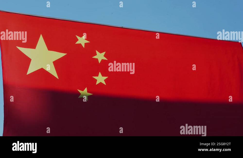 The People's Republic of China flag is displayed as a shadow covering ...