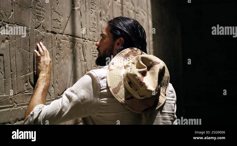 a man closely watching hieroglyphic symbols Stock Video Footage - Alamy