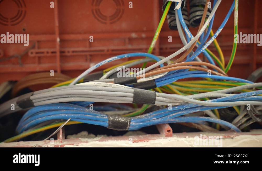Electrical cables wrapped with black insulting tape inside the junction ...