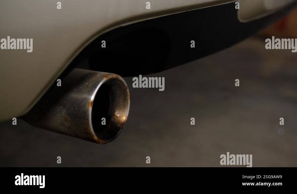 combustion fumes coming out of car exhaust pipe Stock Video Footage - Alamy