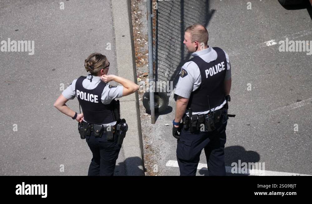 The motion of police officers chatting together beside the police ...