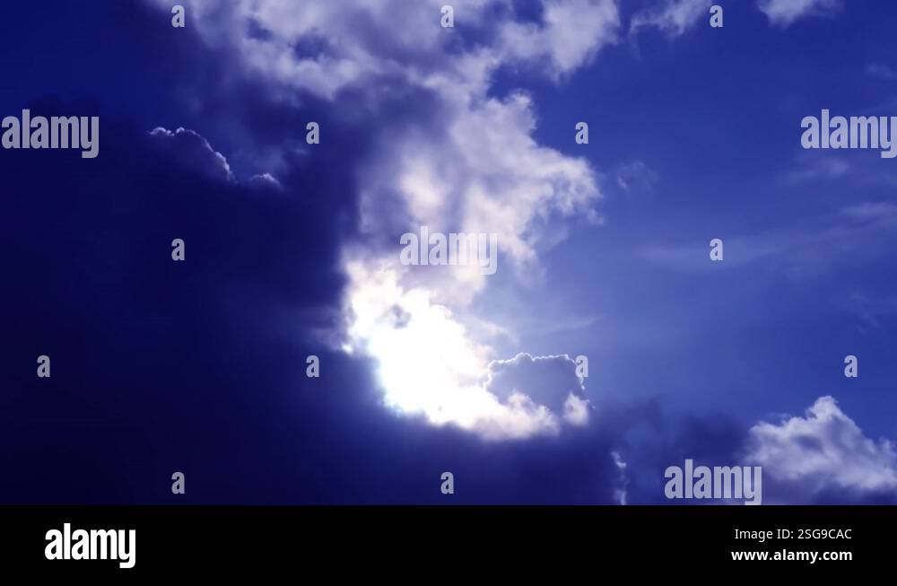 Navy blue sky with Bright sun light ray n sunbeam lens flare in rain ...