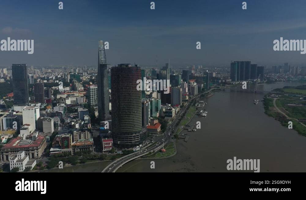Saigon River and canal waterfront with Ho Chi Minh City Skyline ...