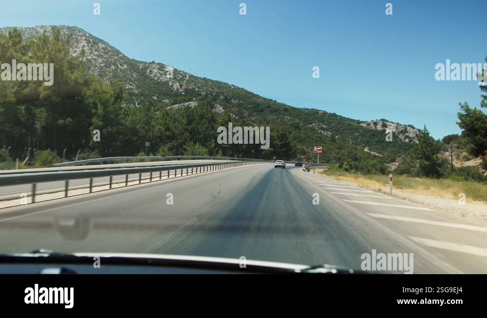 Driving along a morning road early in the morning. Point of view ...