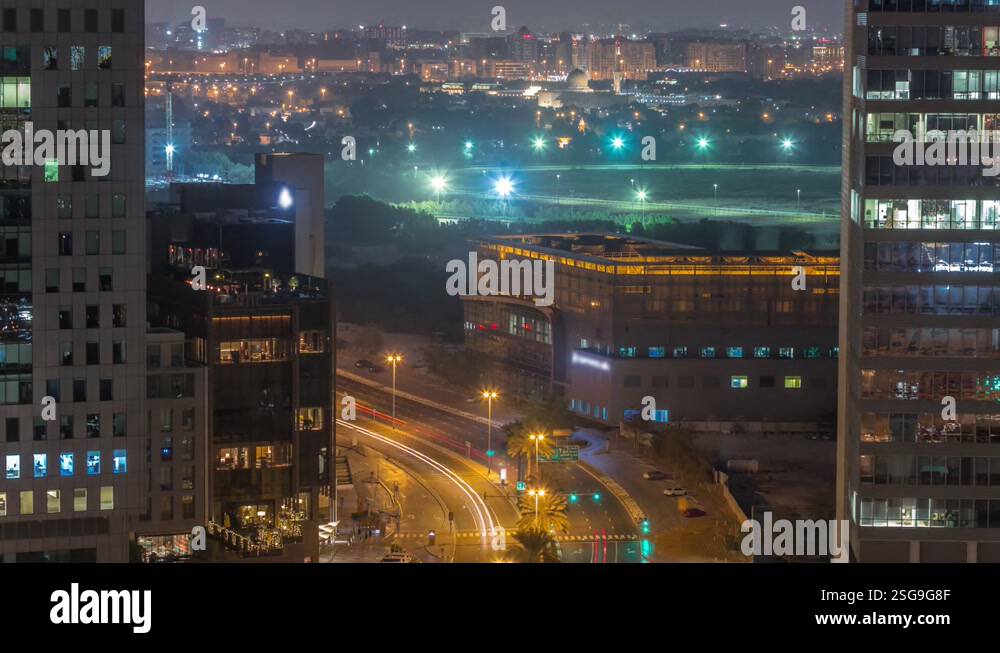 Skyline view of traffic on Al Saada street near DIFC district night to ...