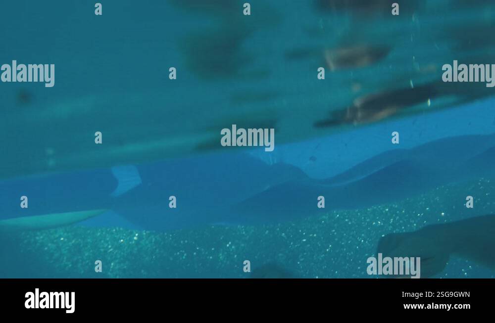 Underwater View Of Man Splashing Woman Floating On Airbed In Swimming ...