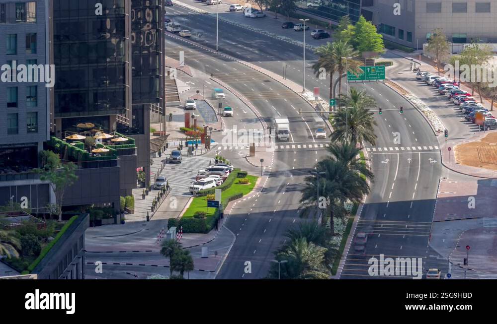 Skyline view of traffic on Al Saada street near DIFC district timelapse ...