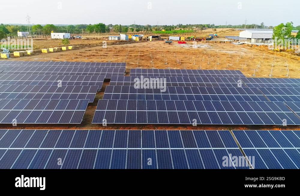 An aerial top view of solar panels installed in an agricultural land ...