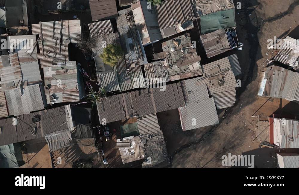 Vertical video.Poverty.Inequality.Aerial view over crowded African ...