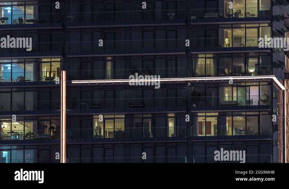 Flat night panorama of multicolor light in windows of multistory ...